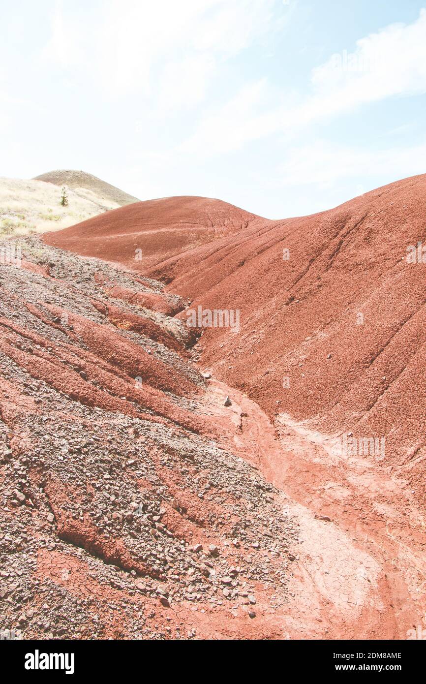 A vertical shot of large piles of sandstone powder in a desert Stock ...
