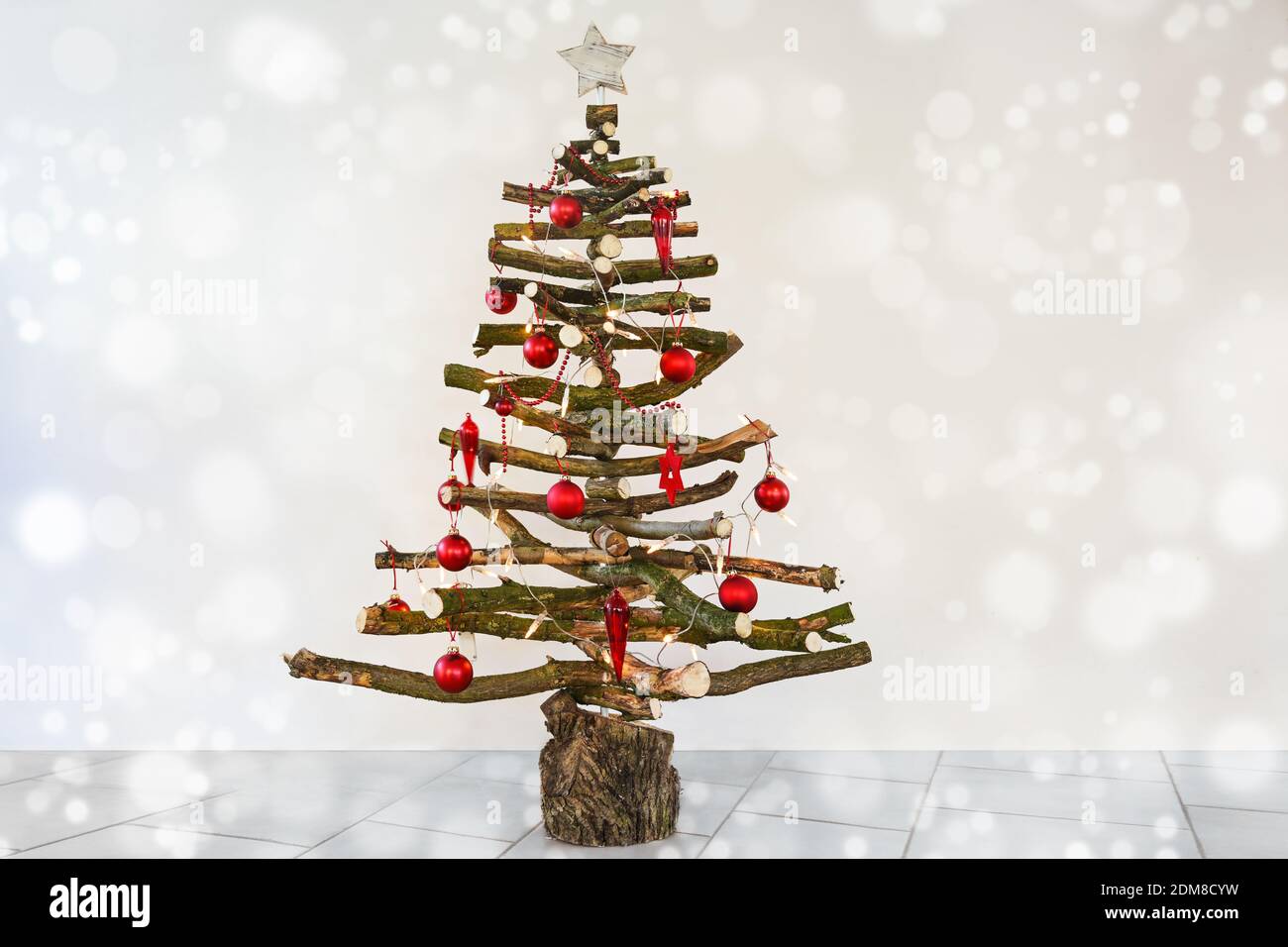 Alternative homemade Christmas tree made of rustic raw wood branches ...