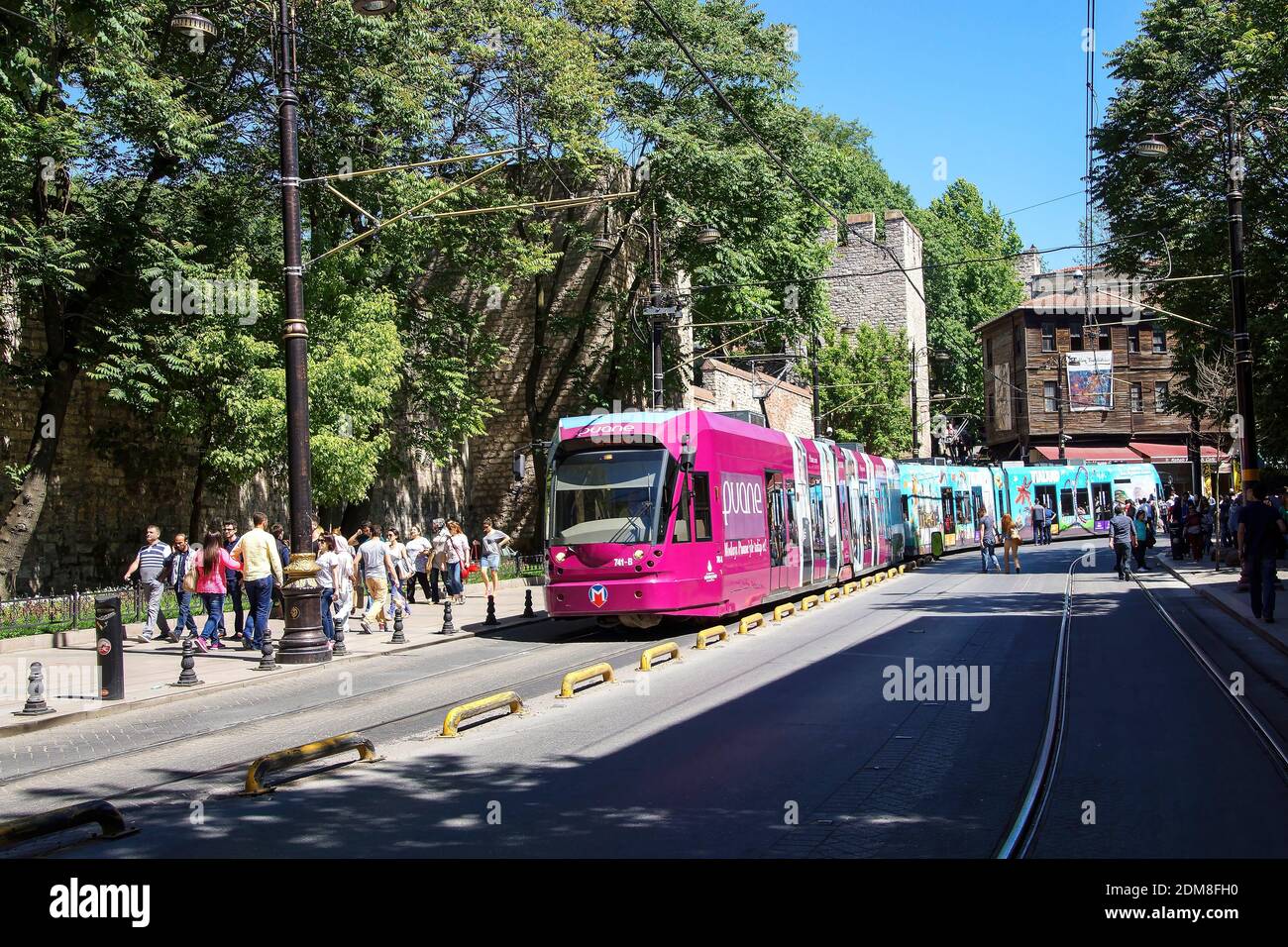 ISTANBUL - MAY 18, 2014 - Colorful tram rapid transit heads down to the ...