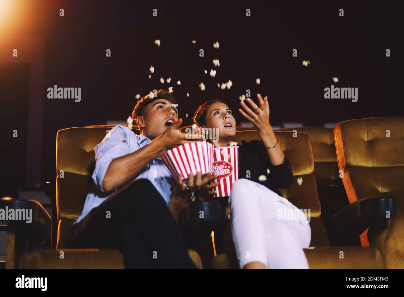 Throwing popcorn in theater hi-res stock photography and images - Alamy