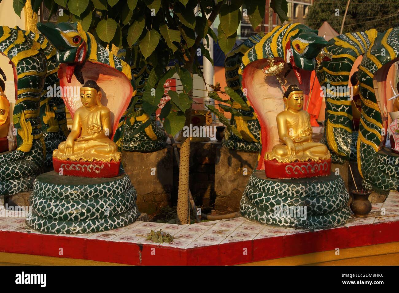 Buddha protected by the naga cobra serpent's hood, Botataung Pagoda ...