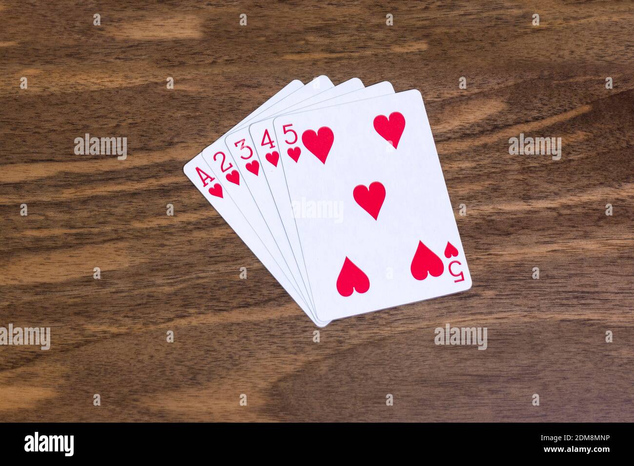 Playing cards, a Straight in a Poker game Stock Photo - Alamy