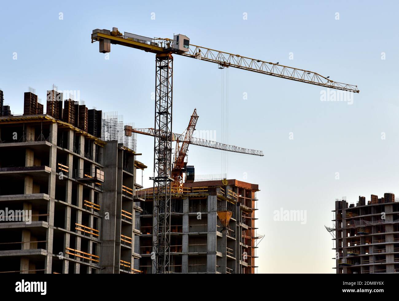 Preparing to pour a bucket of concrete into formwork.Tower crane ...