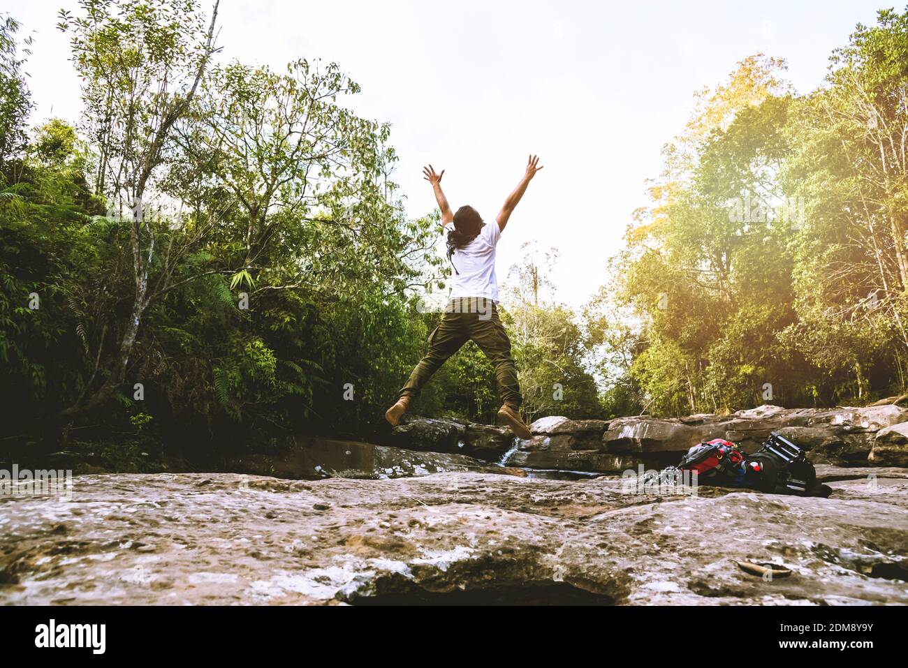 Man jumping over river hi-res stock photography and images - Alamy