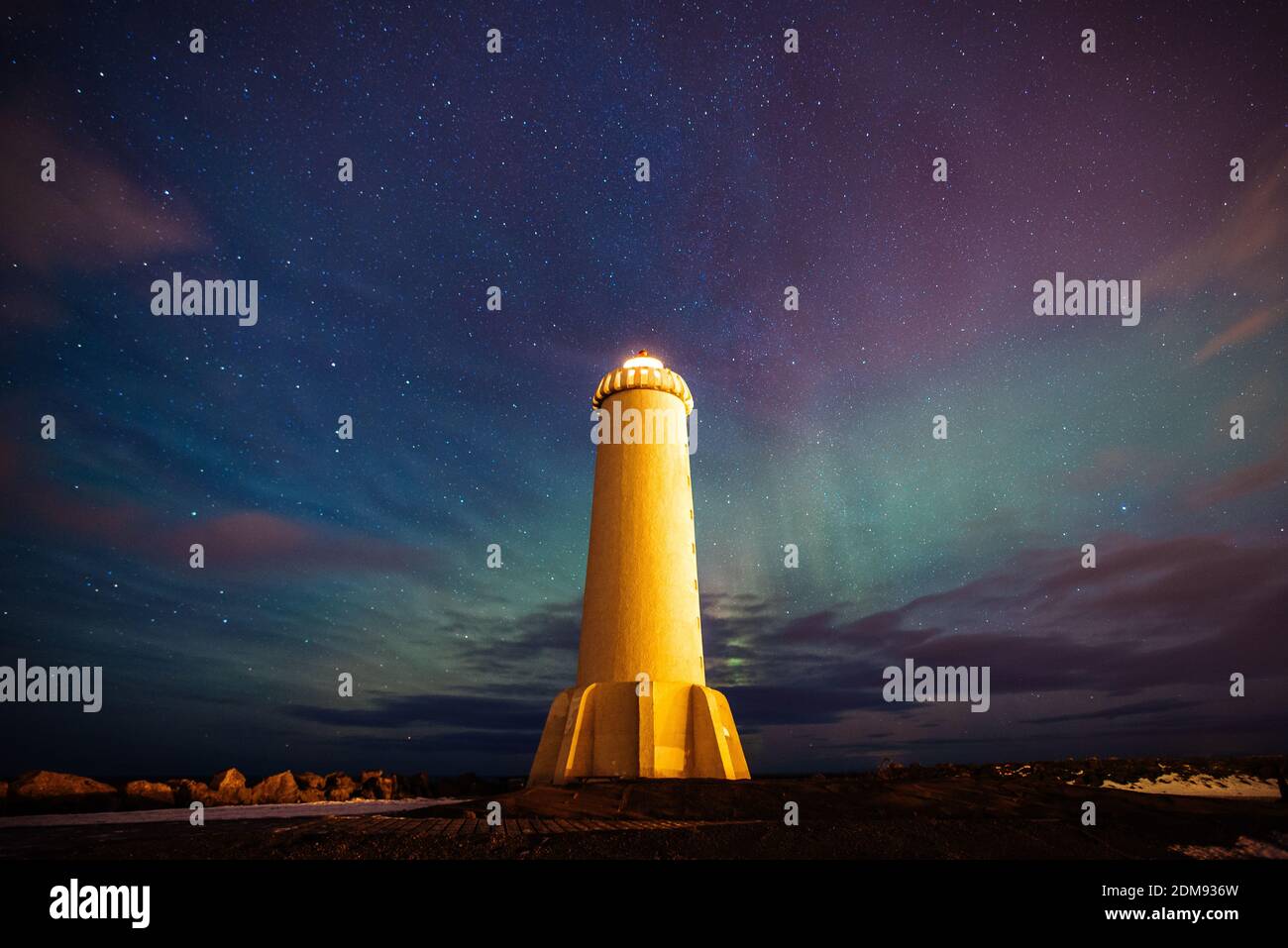 Lighthouse in Akranes Iceland with colorful clouds and northern lights ...