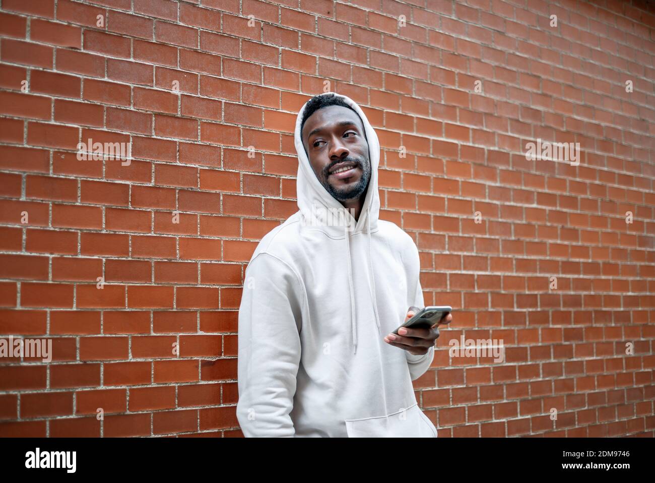 Person in hood wall attitude hi-res stock photography and images - Alamy
