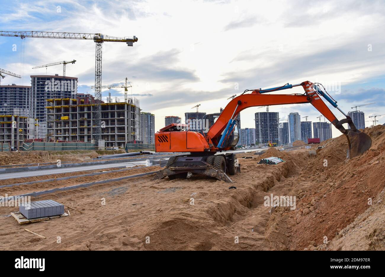Hydraulic excavator installing pipeline hi-res stock photography and ...