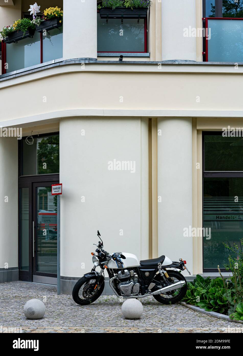A Motorcycle Is Parked In Front Of The Front Door Stock Photo - Alamy