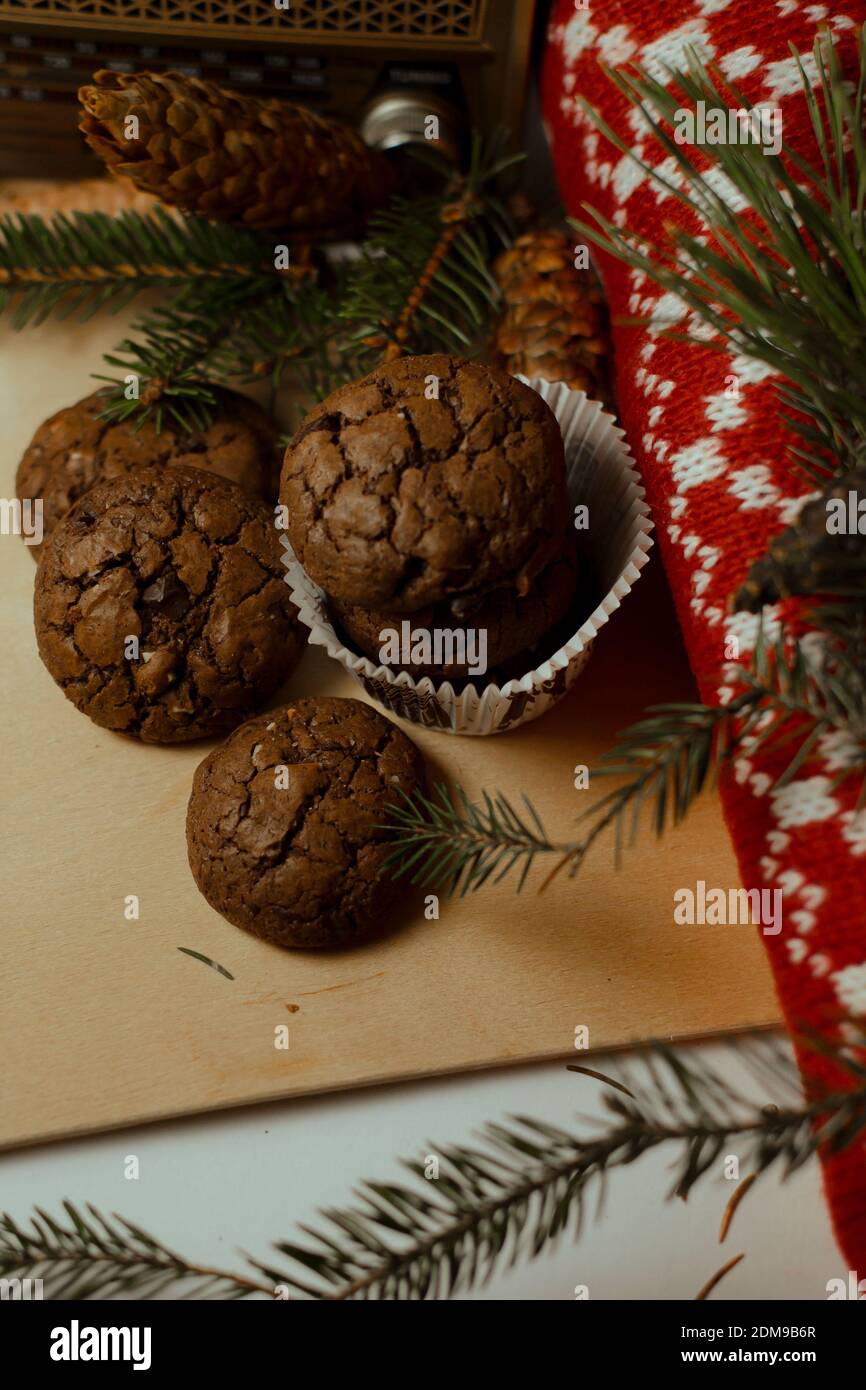 Americano cookies with dark chocolate pieces and nuts are surrounded ...
