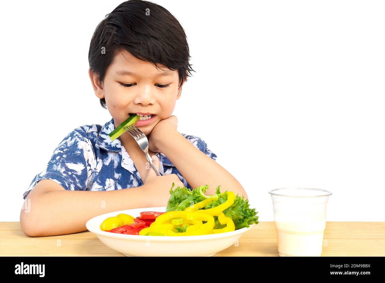 Boy eating vegetables milk hi-res stock photography and images - Alamy