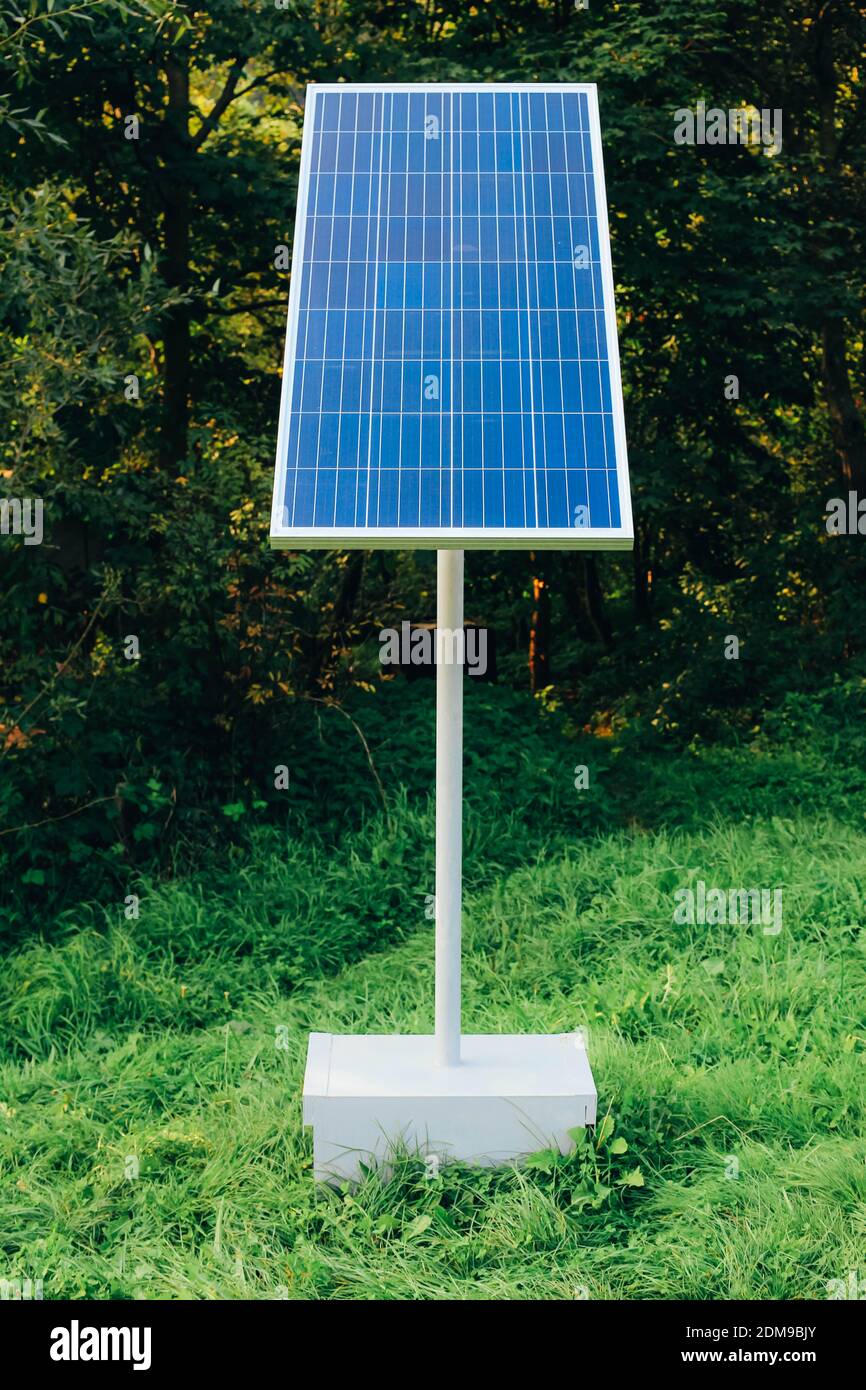 Solar battery on the trees background. Modern alternative ...