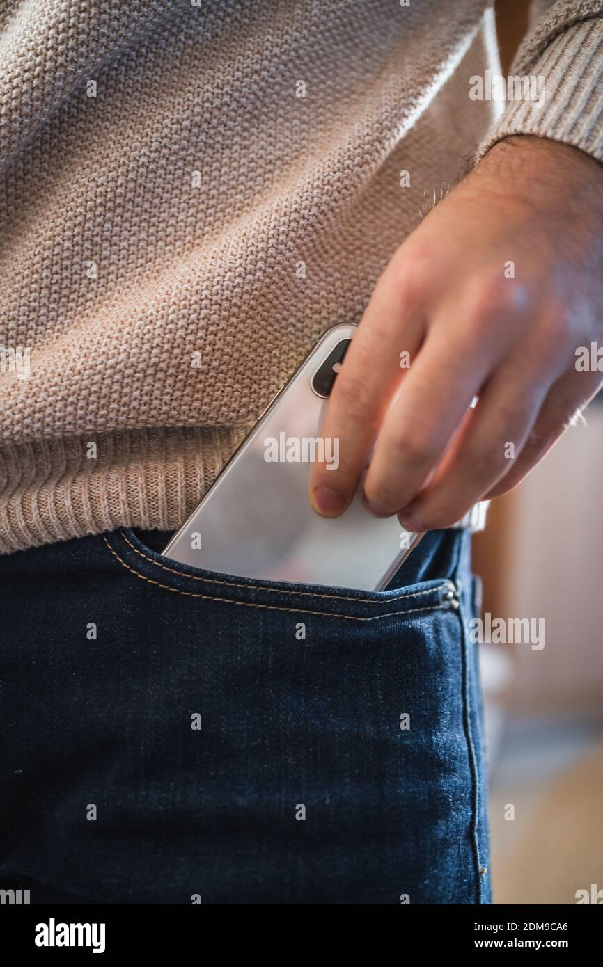 Man taking phone from pocket hi-res stock photography and images - Alamy