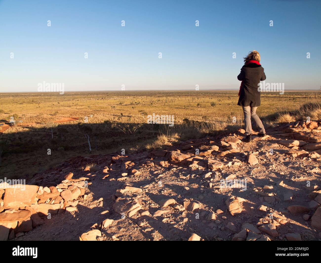 Tourist standing on top of Wolfe Creek Meteorite Crater, Western ...