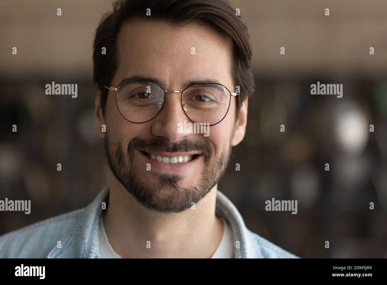 Portrait of smiling millennial man in glasses Stock Photo - Alamy