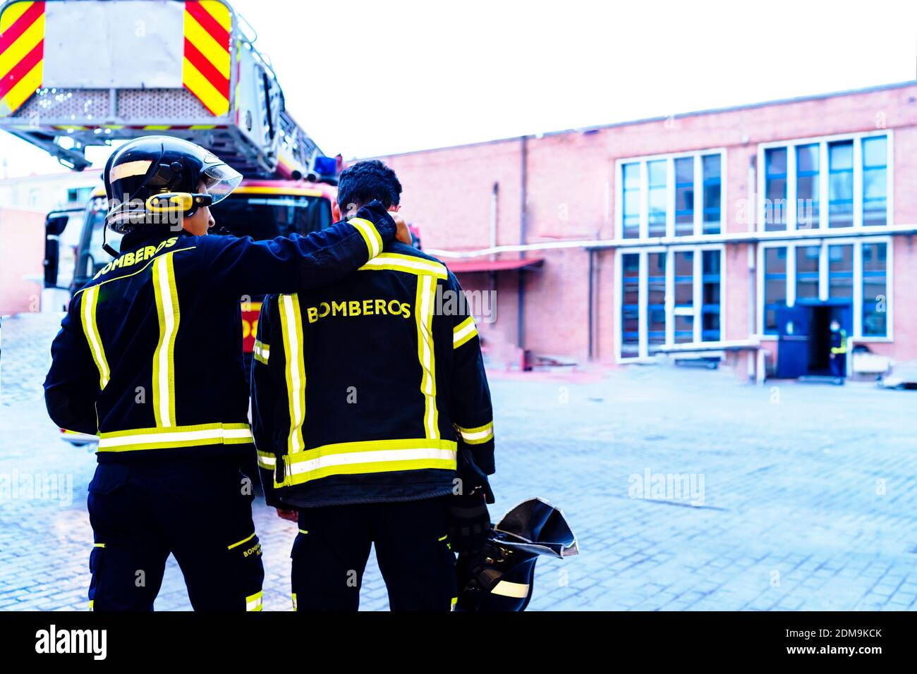 firefighter cheering for his dejected partner after a fire Stock Photo ...
