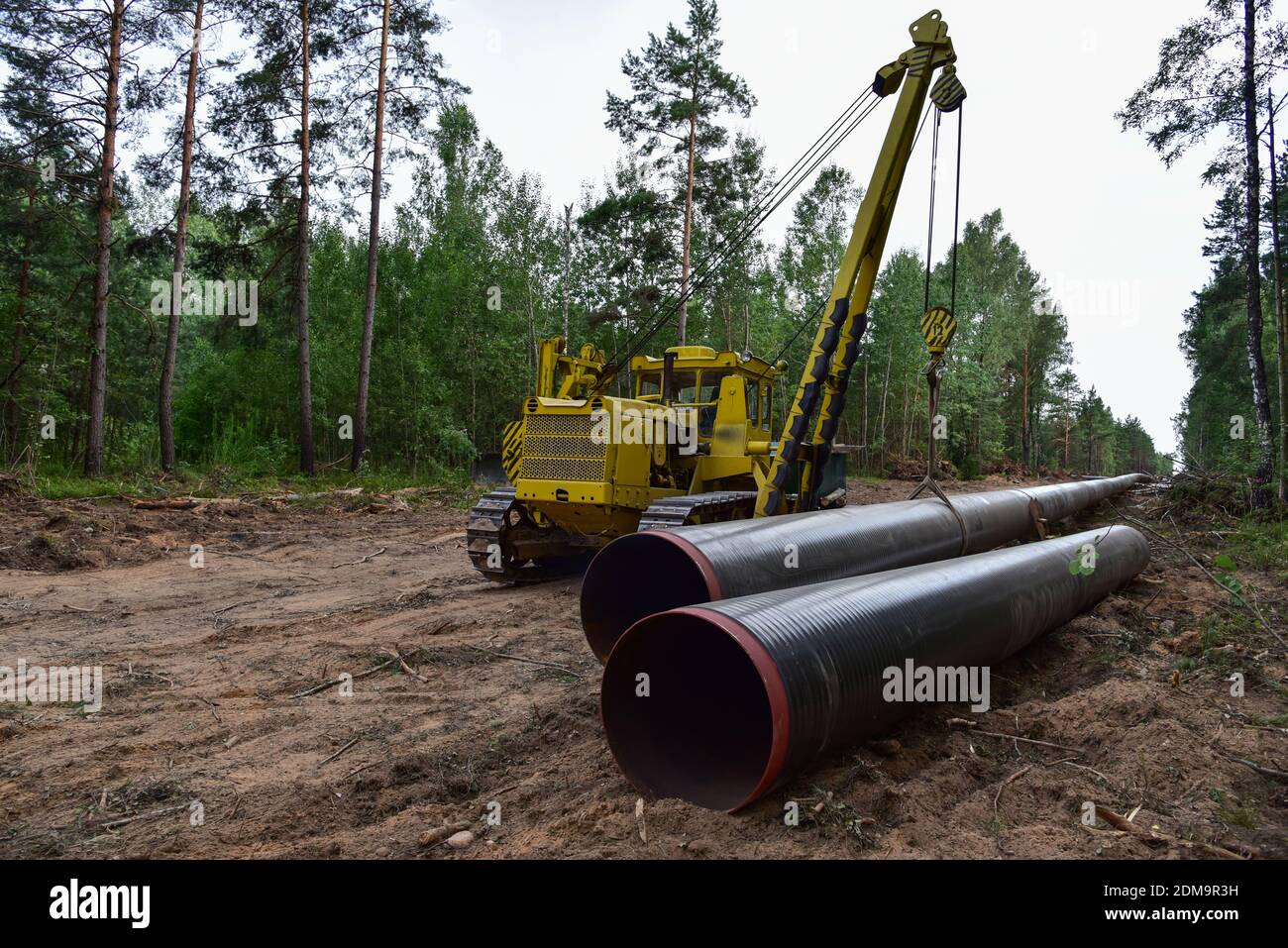 Pipelayer with side boom Installation of gas and crude oil pipes in ...