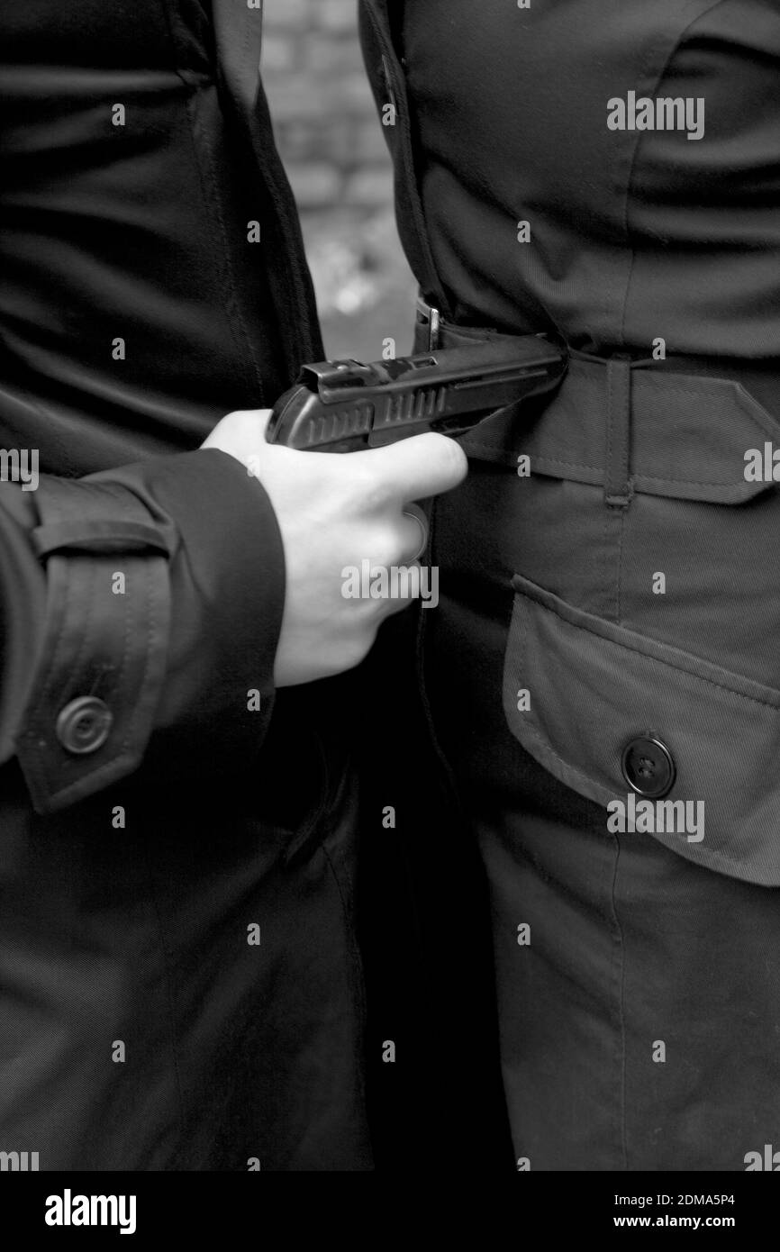 Man hand holding two gun hi-res stock photography and images - Alamy