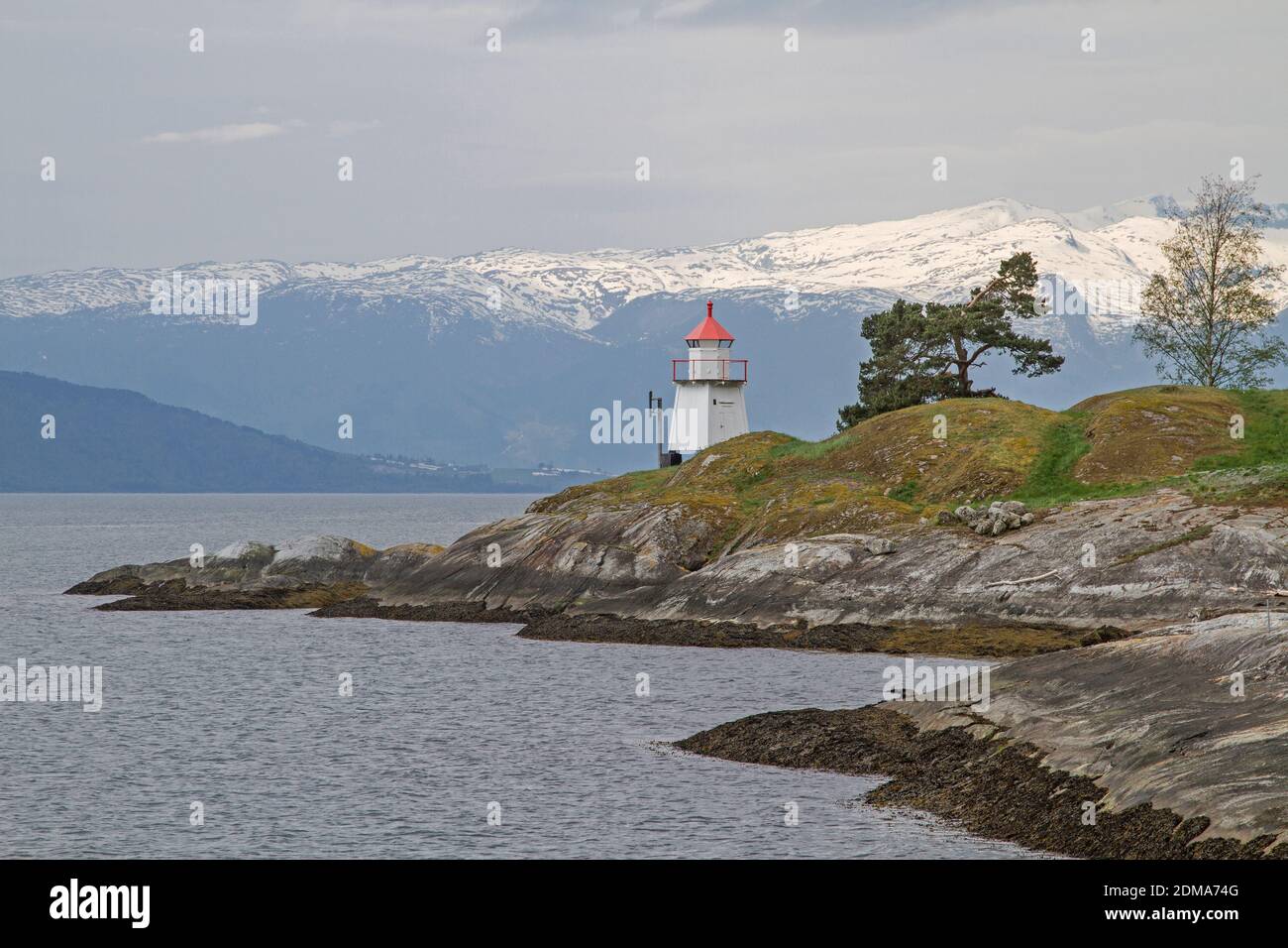 This Idyllic Lighthouse Stands On The Banks Of The Sognefjord Near ...