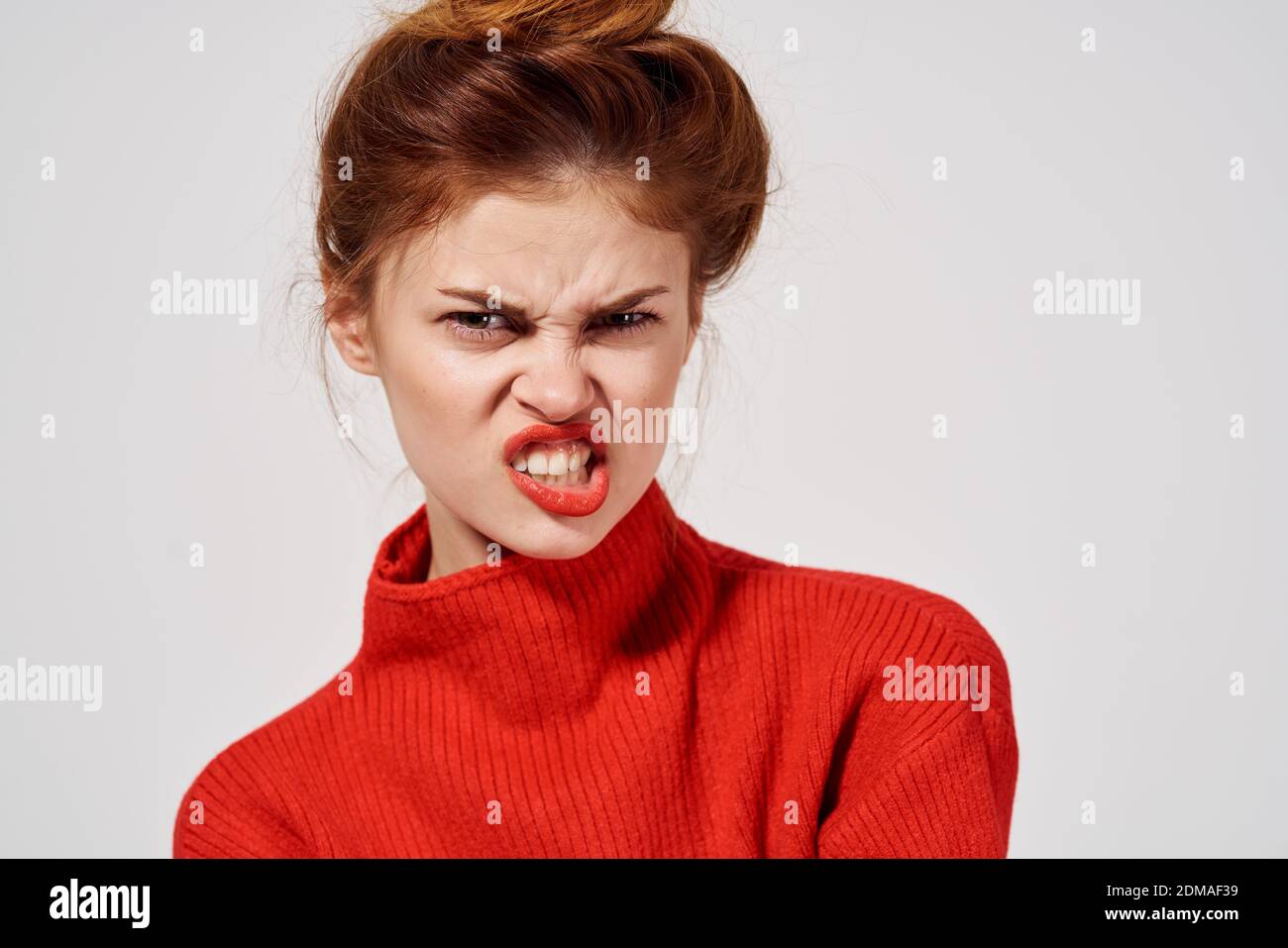 energetic woman in red sweater emotions fun irritability model Stock ...