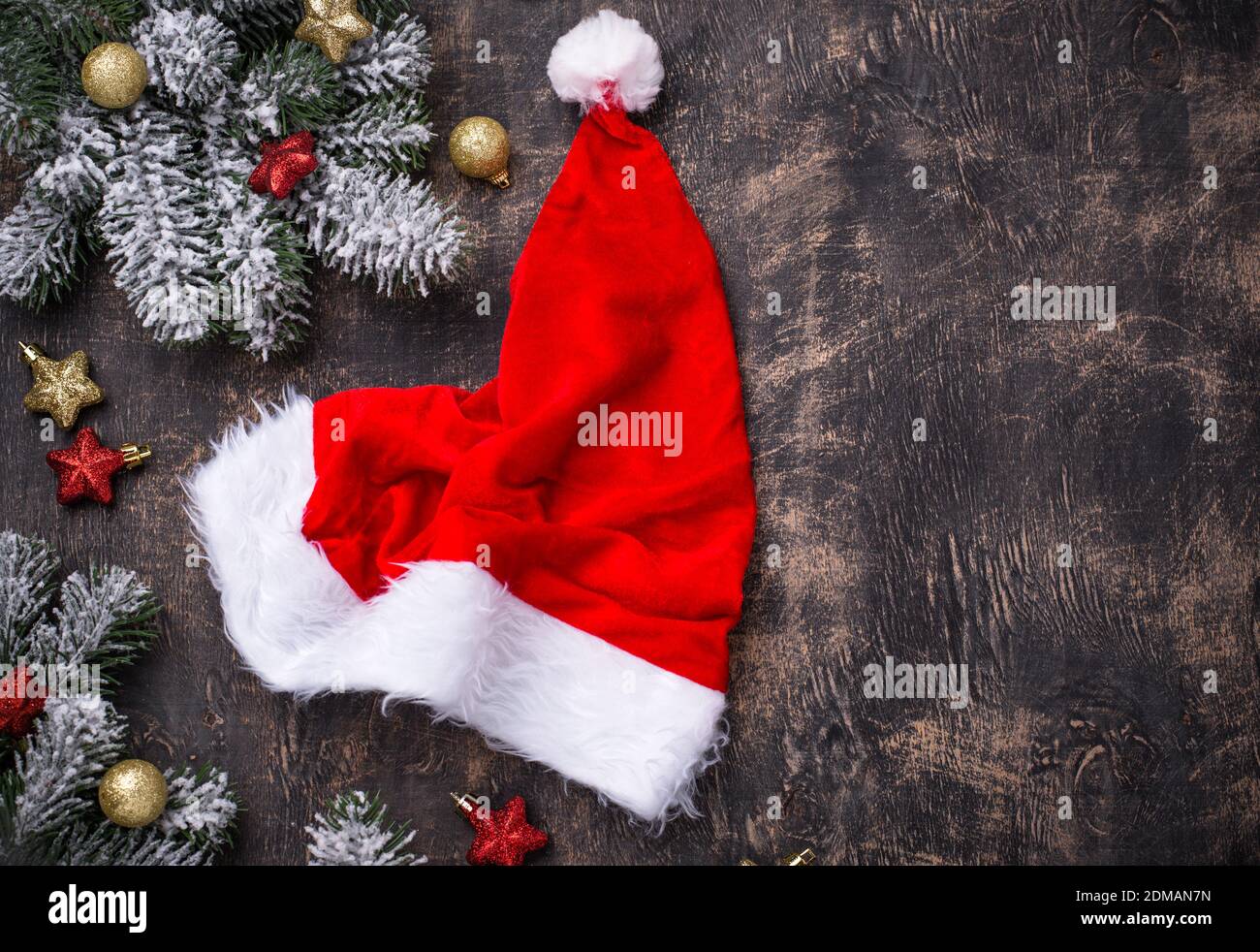 Christmas dark background with Santa hat Stock Photo - Alamy