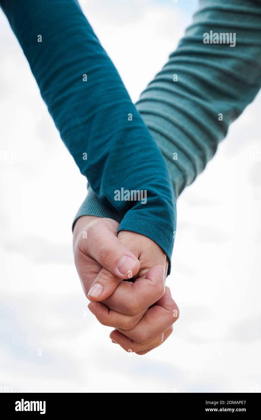 Two Intertwined Hands High Resolution Stock Photography and Images - Alamy