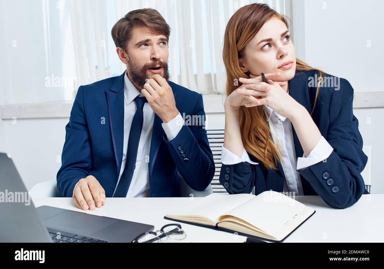 Employees in the office with laptop puzzled look documents emotions ...