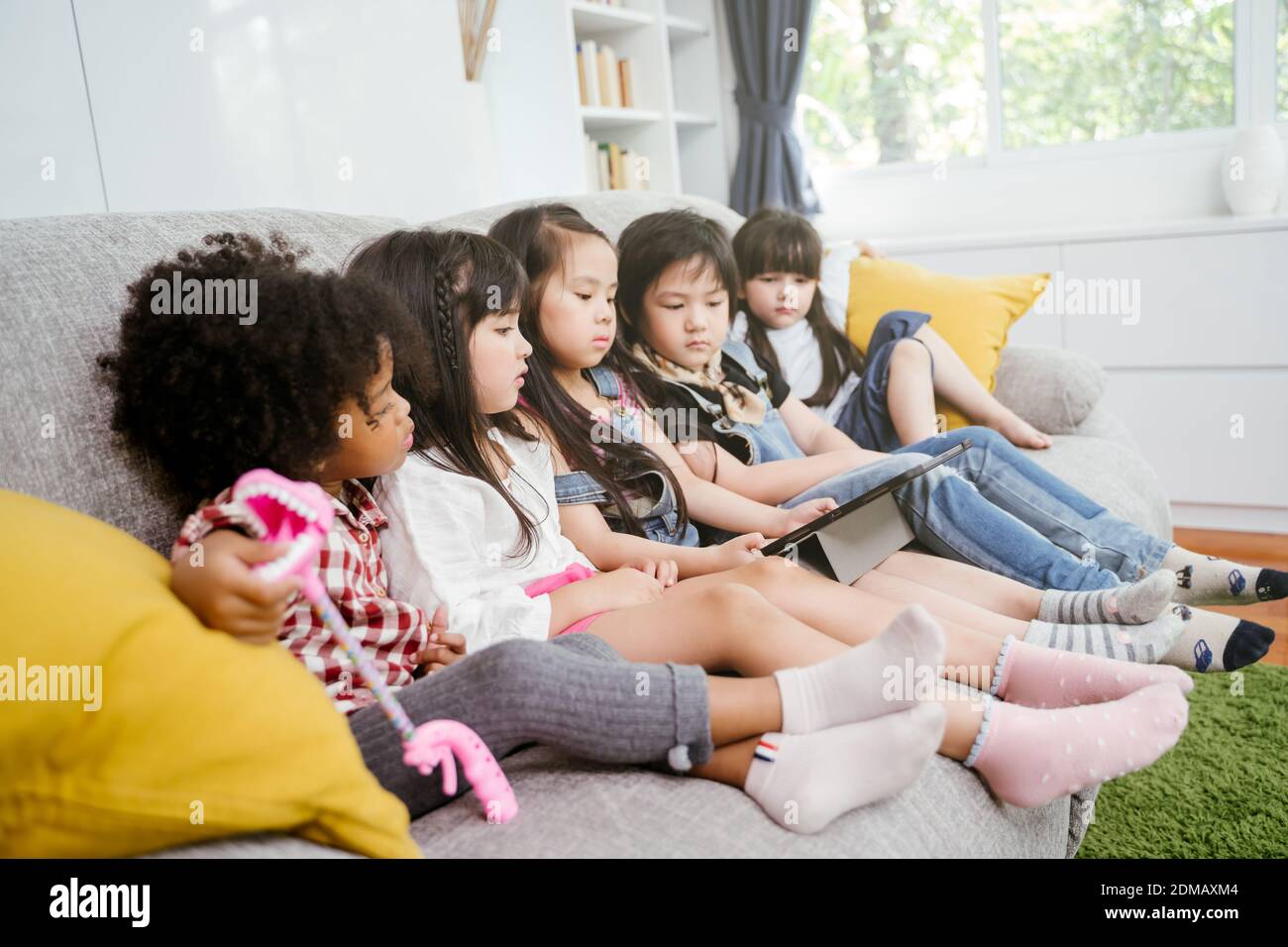 Children play on tablets hi-res stock photography and images - Alamy