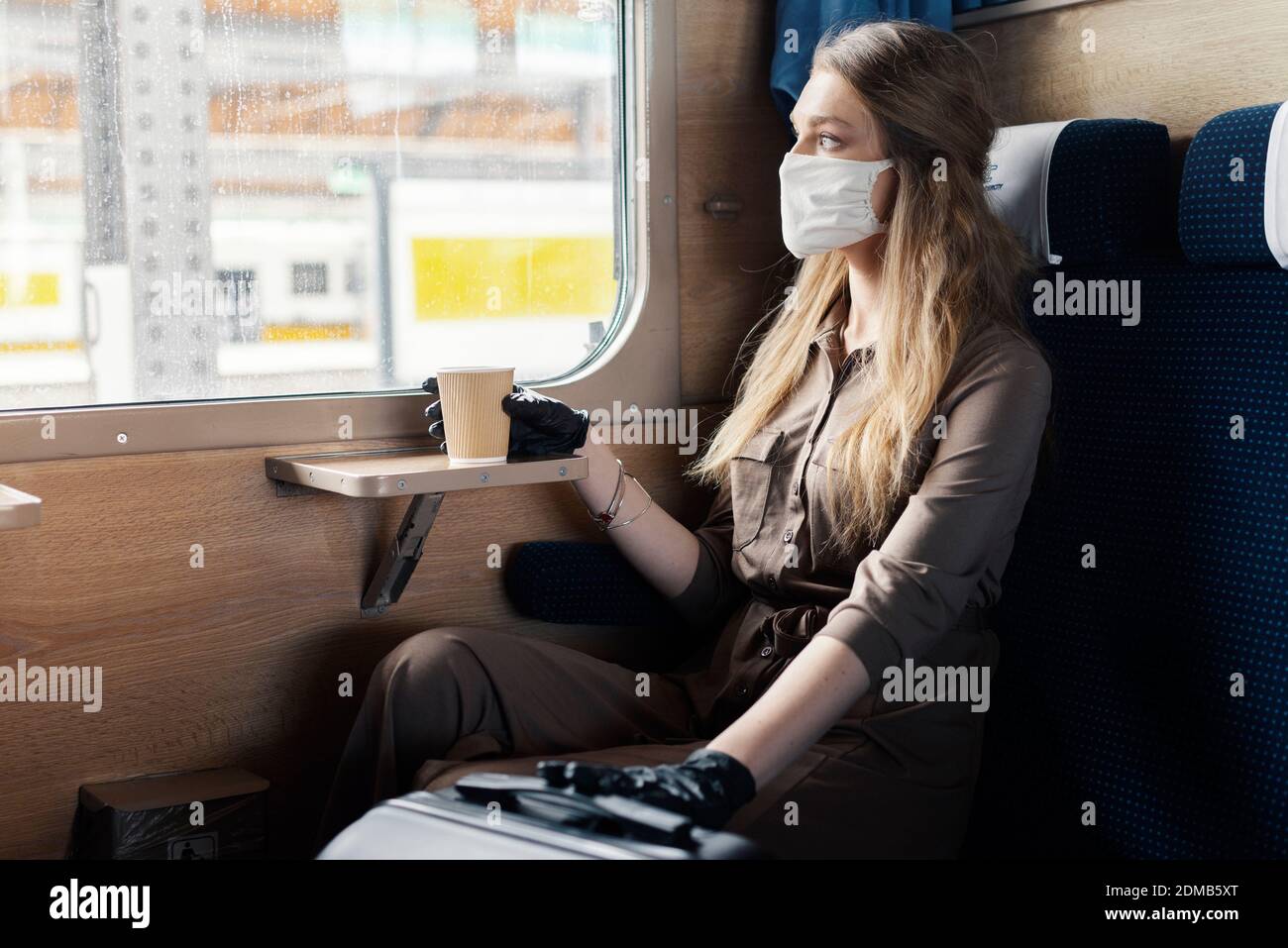 Woman Wearing Mask Sitting In Train Stock Photo - Alamy