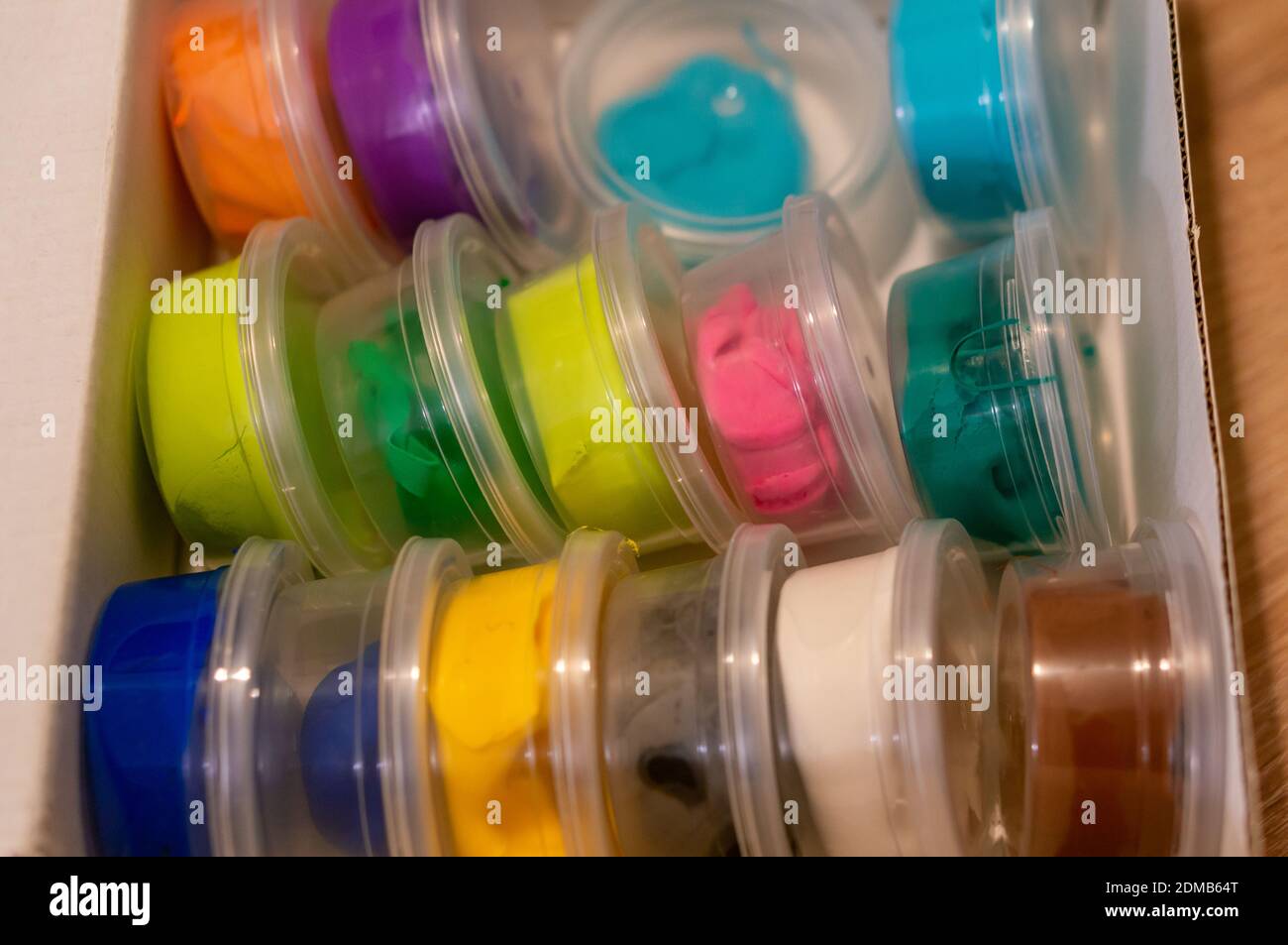A high angle shot of colorful play doughs in small packs in a box Stock ...