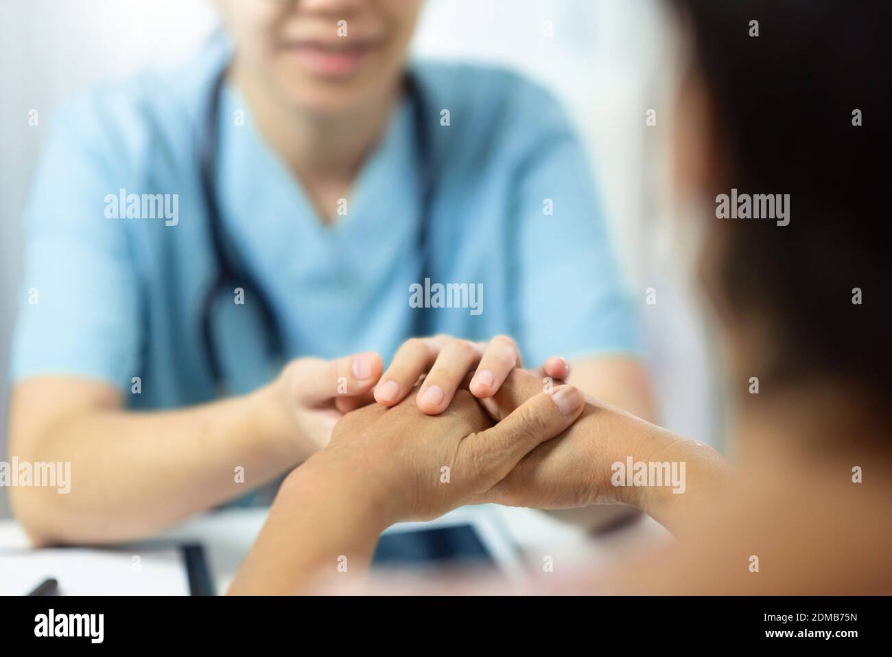 Giving consolation hi-res stock photography and images - Alamy