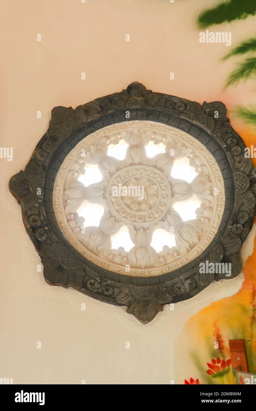 carved circle window in brahma vihara arama buddhist temple, bali ...