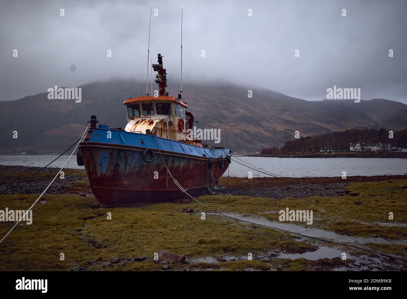 Abandoned, rusty and dilapidated. Stormy day with many clouds and fog ...