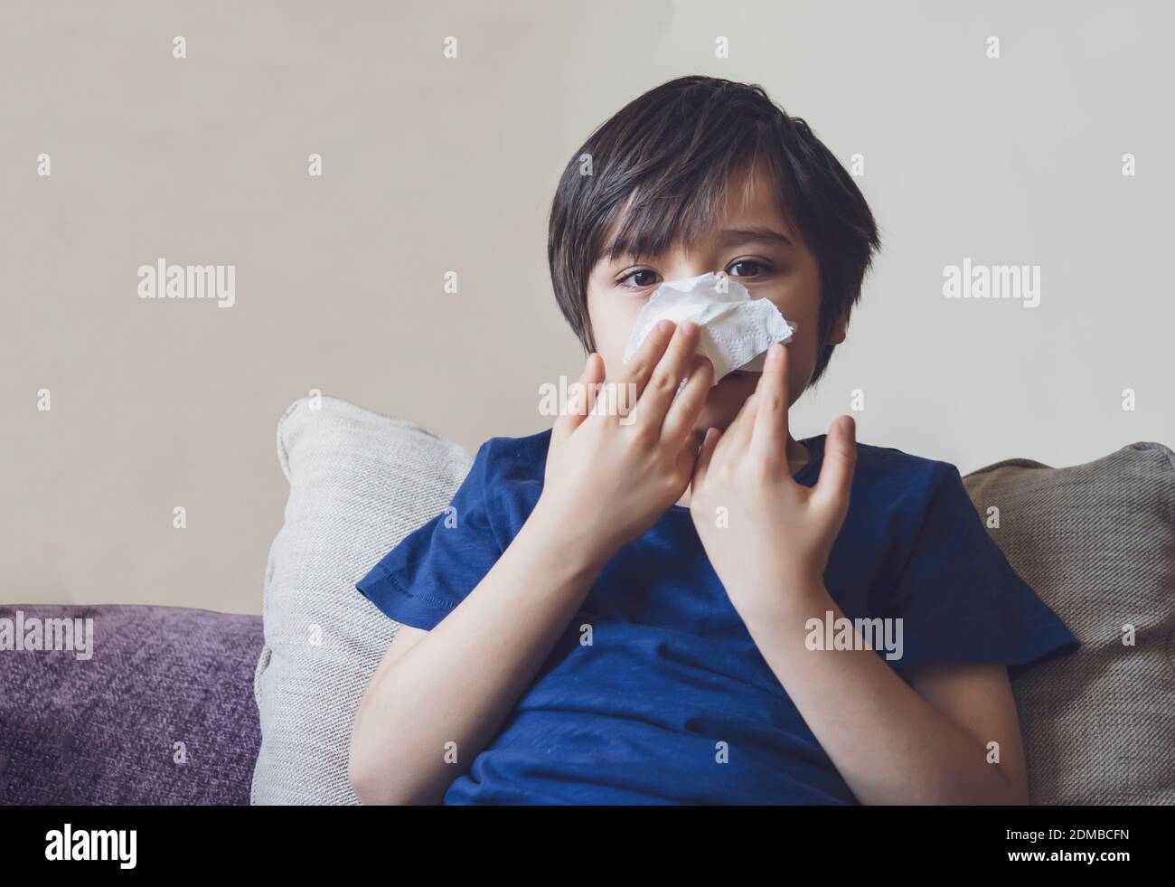 Asian kid blowing nose hi-res stock photography and images - Alamy