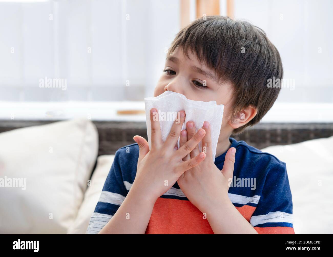 Asian kid blowing nose hi-res stock photography and images - Alamy