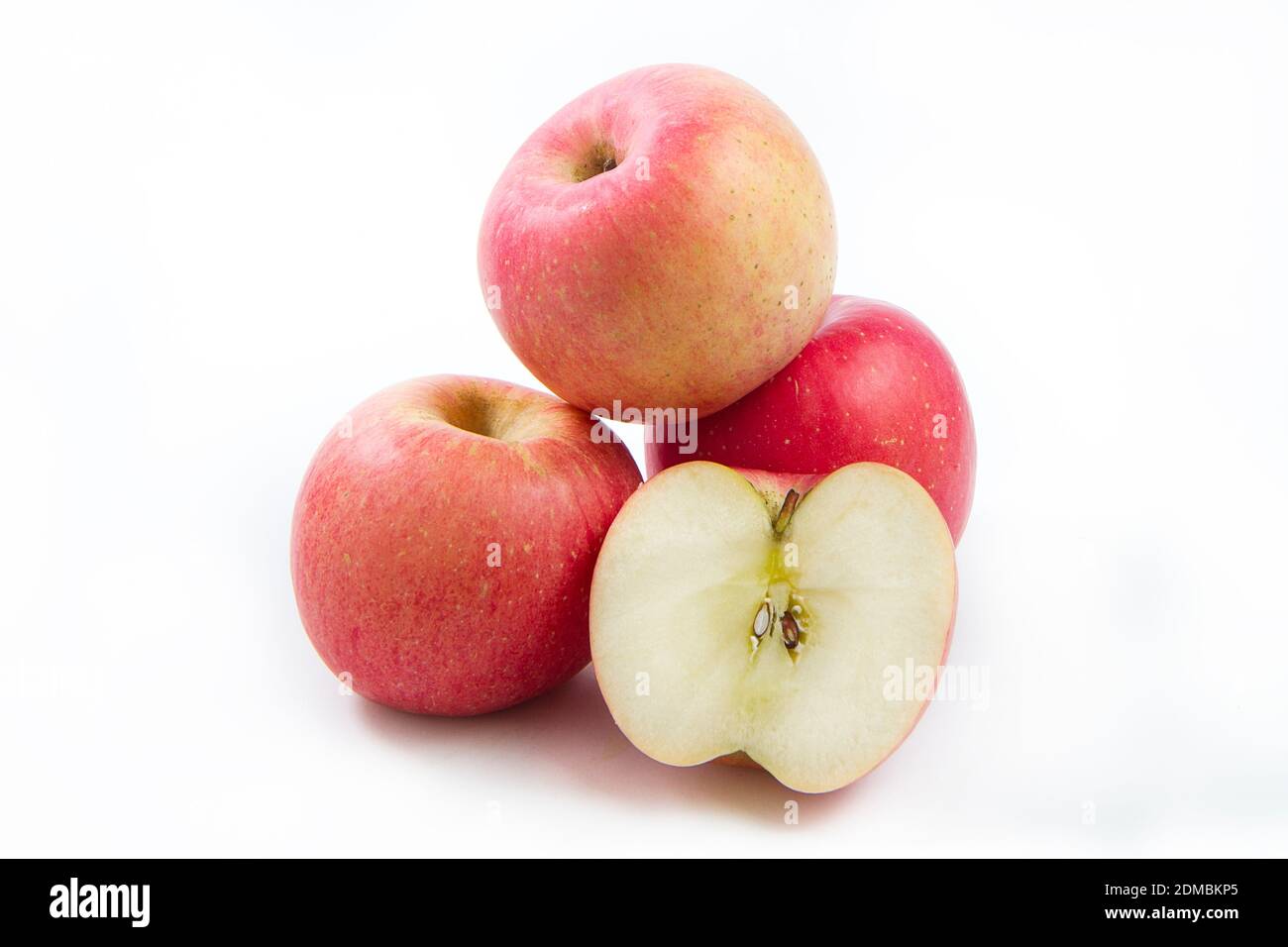 Fuji Apple Cut In Half Isolated On White Background With Clipping Path ...