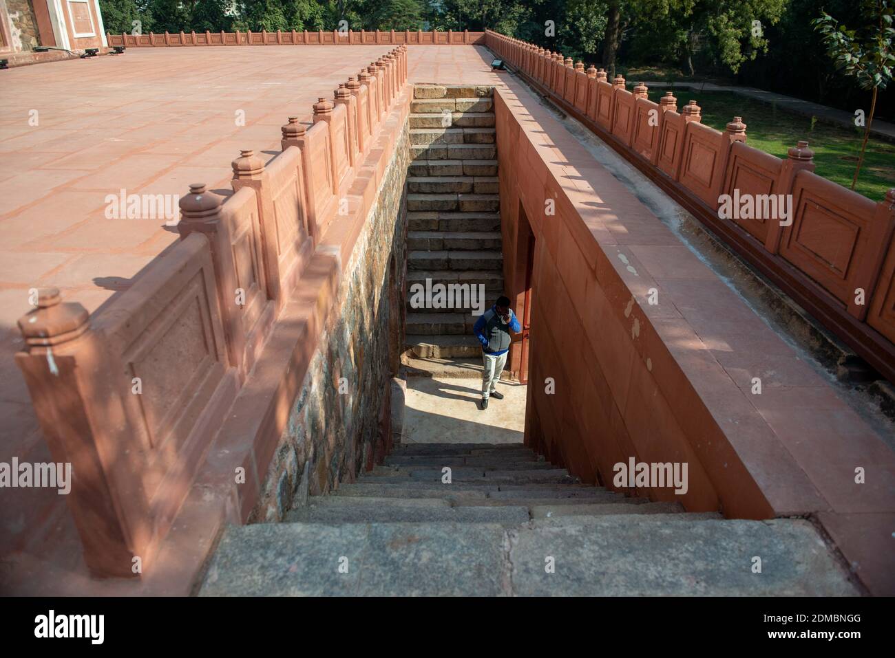 A media person stands at the stairs of the tomb during the event ...