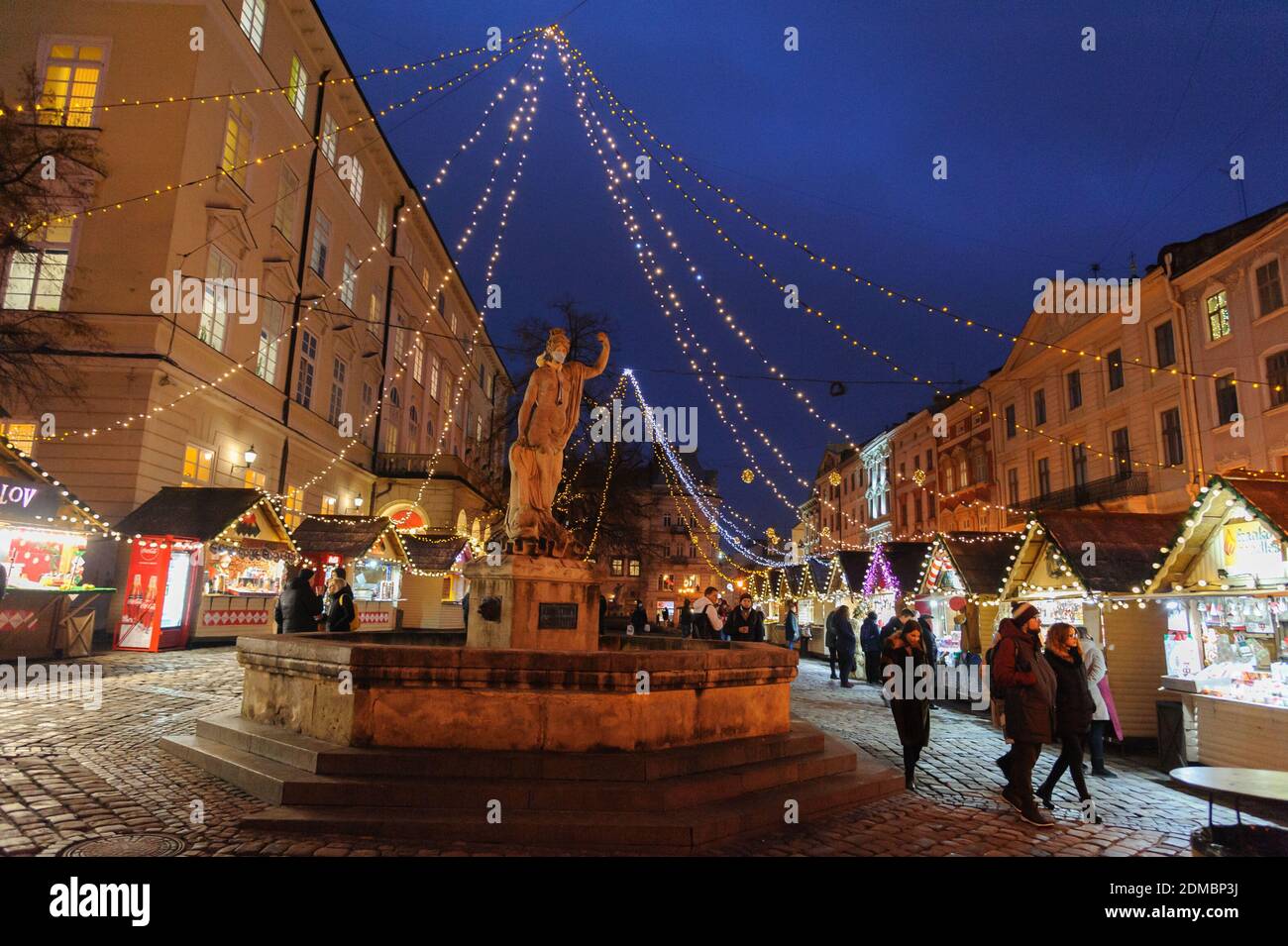 Stalls at the Amphitrite monument with Christmas decorations and lights ...