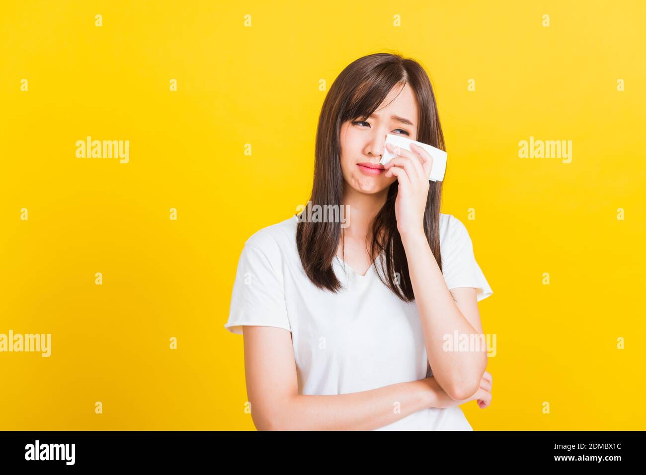 Young asian woman crying while wiping tears hi-res stock photography ...