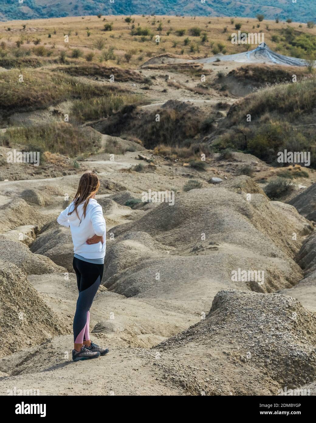 Young girl exercising outdoors and wearing sportswear, picture taken in ...