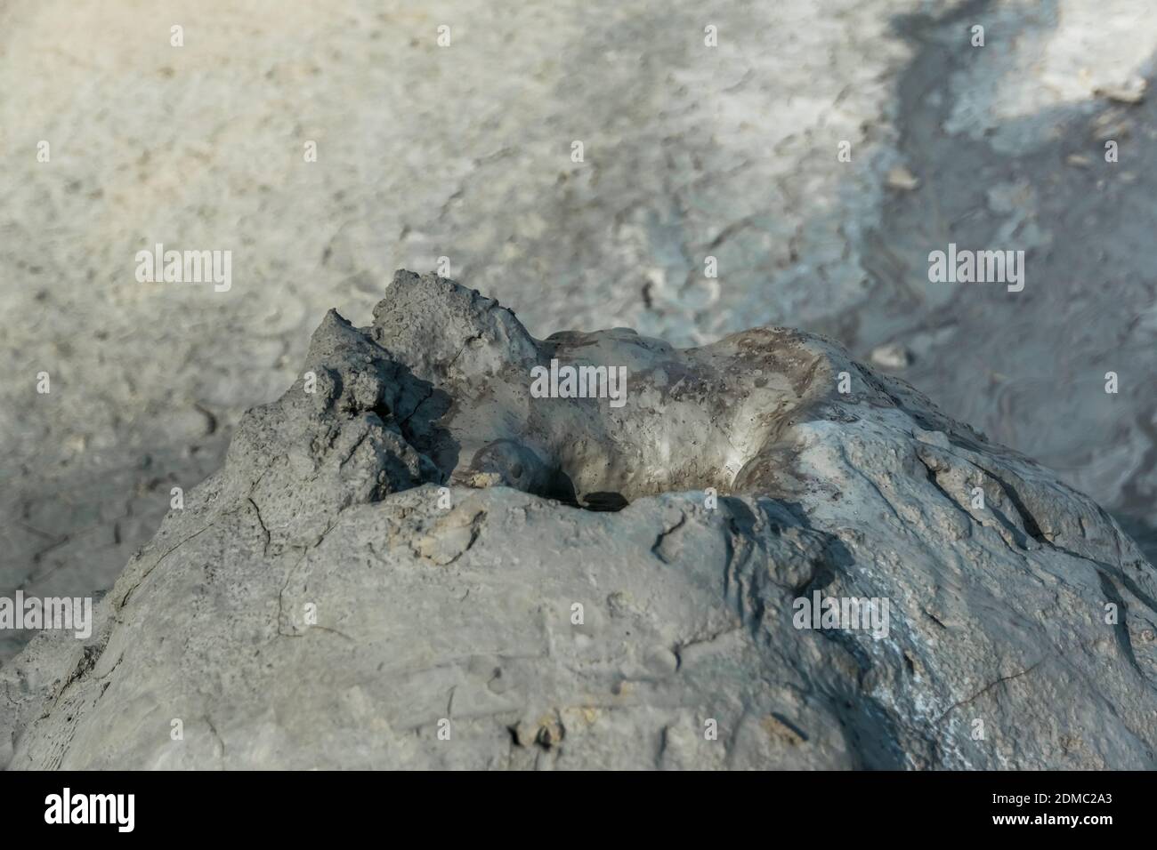 Grey active mud volcano's crater captured in the mud volcanoes park in ...