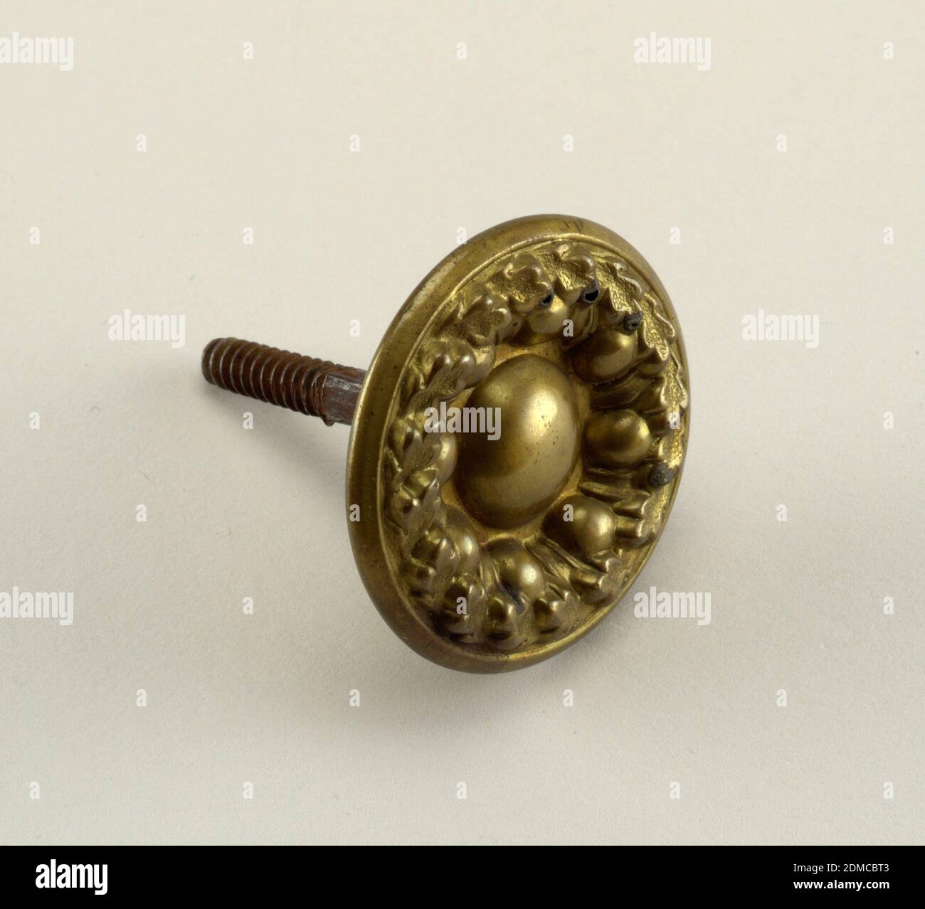 Mount, brass, Repousee head with boss surrounded by gadrooning and band ...