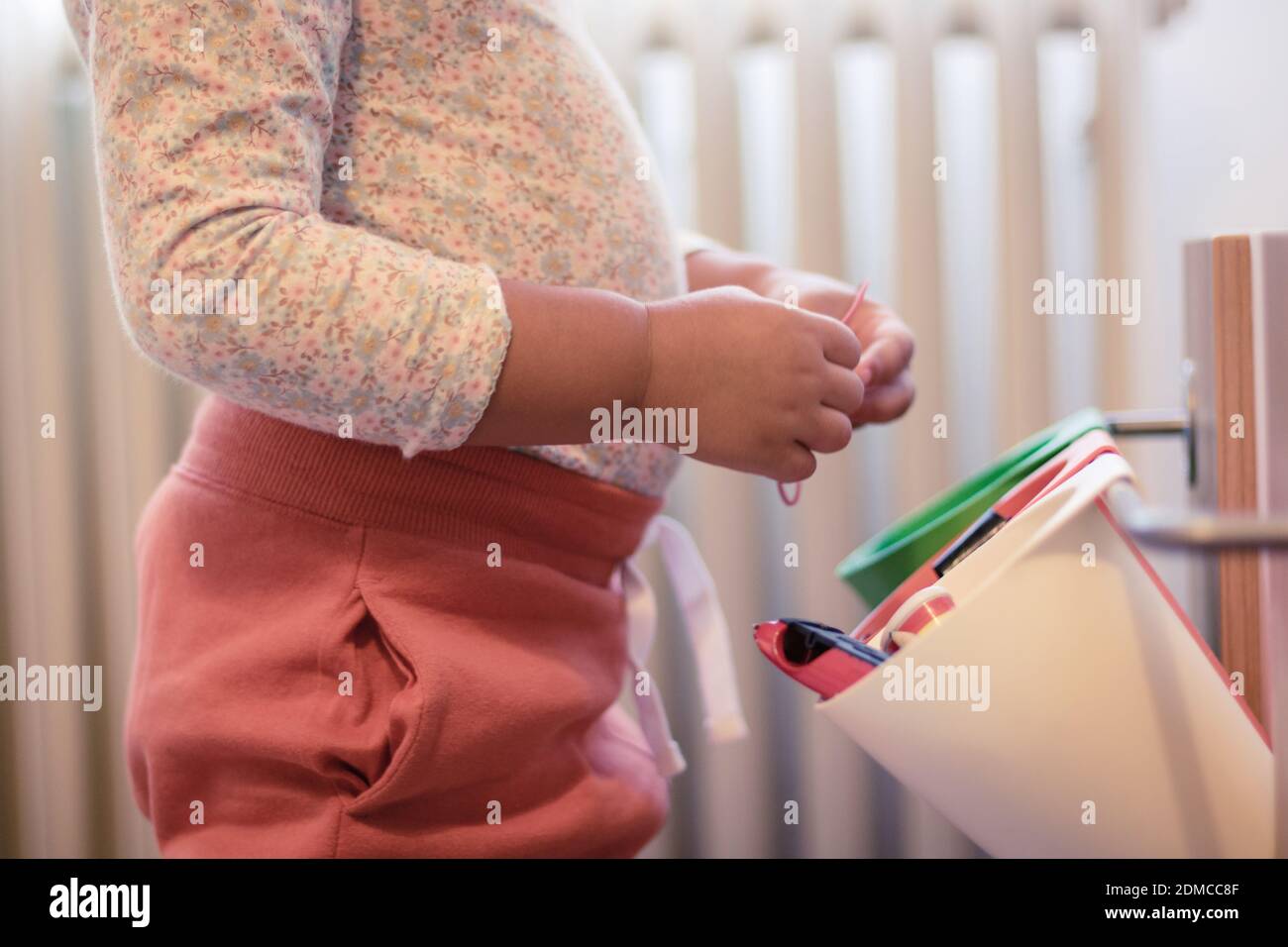 Child picking up toys hi-res stock photography and images - Alamy