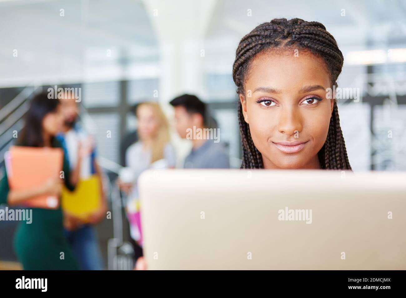 African woman working as programmer with computer in start-up Stock ...