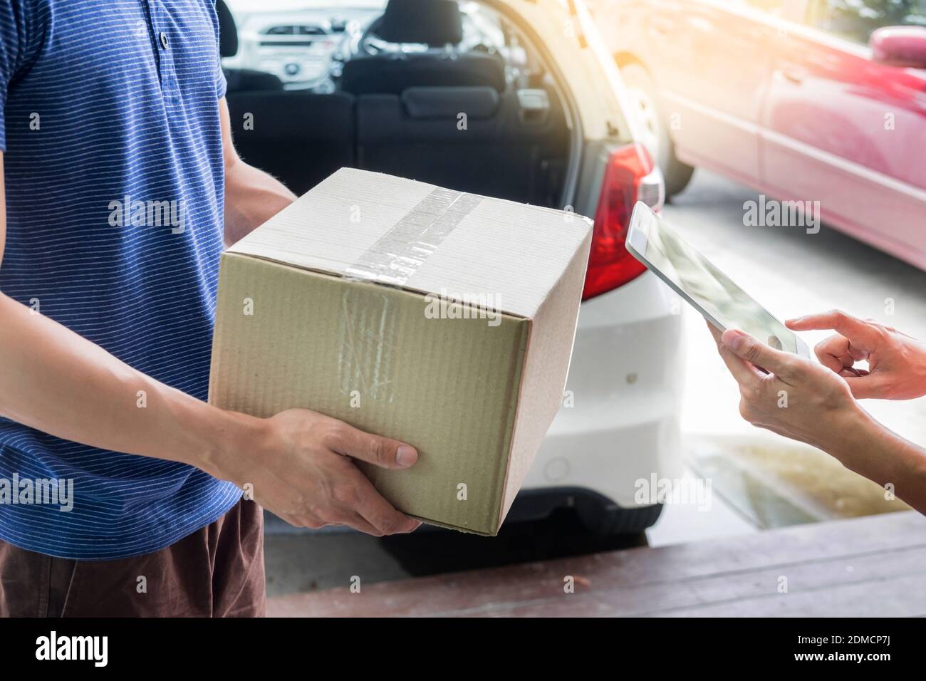 Signing For A Parcel High Resolution Stock Photography and Images - Alamy
