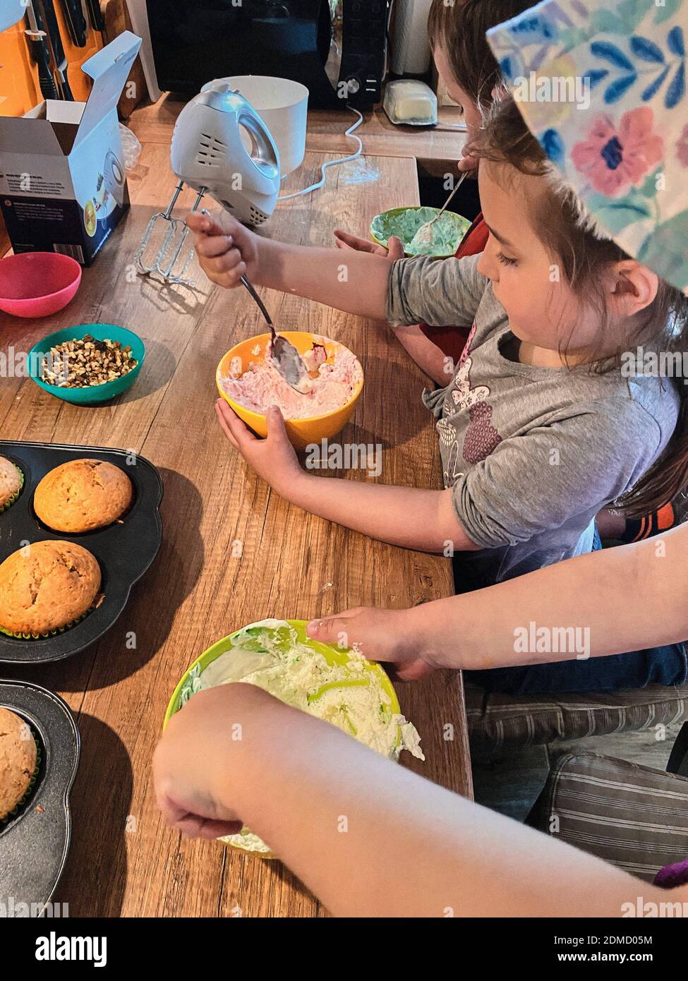 Children decorating cupcakes together hi-res stock photography and ...