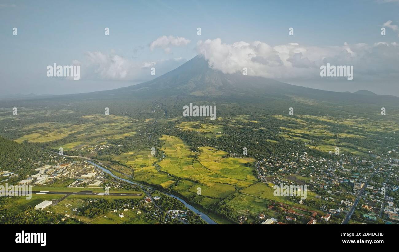 Volcano erupt at countryside cityscape aerial. Urban cottages with ...