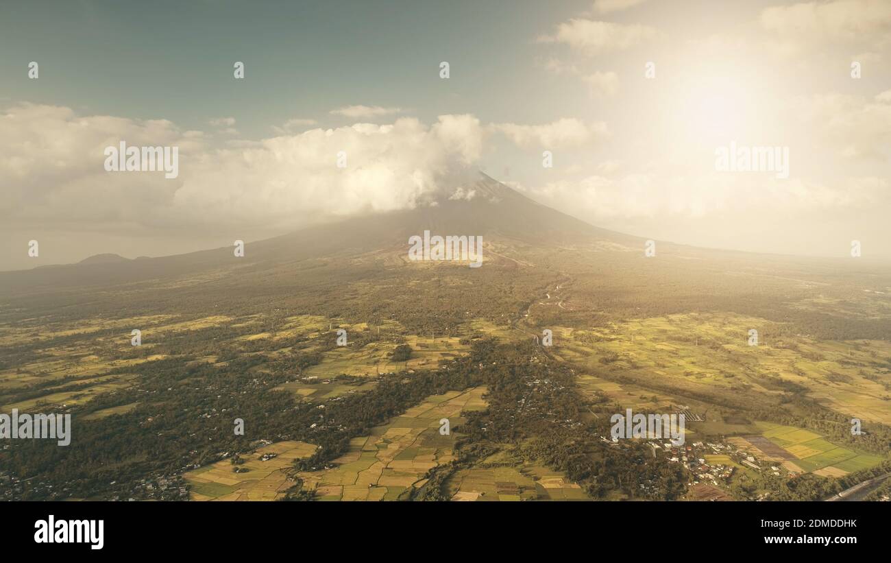 Tropic sun farmlands at green volcano hillside valley aerial. Legazpi ...