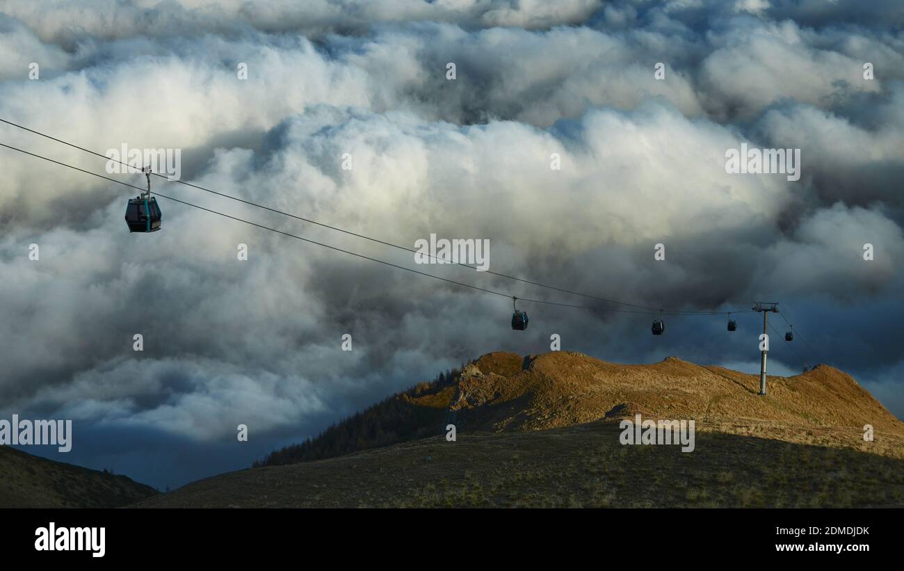 Fluffy clouds on top mountains hi-res stock photography and images - Alamy