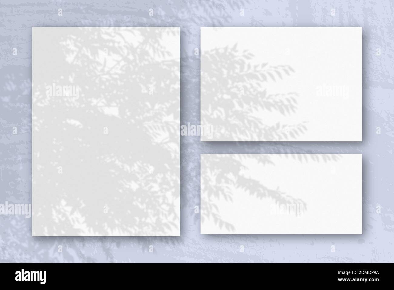 Several horizontal and vertical sheets of white textured paper against ...