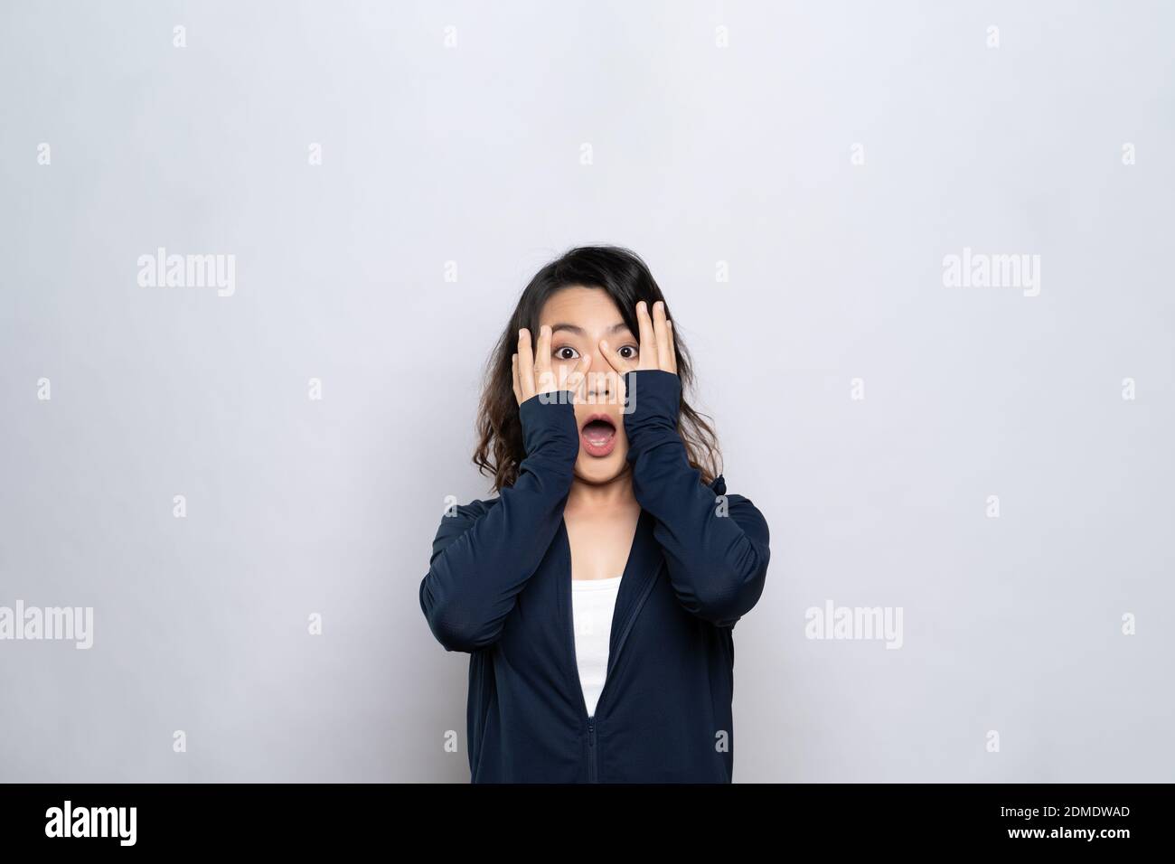 Woman feel scared standing isolated over white background Stock Photo ...
